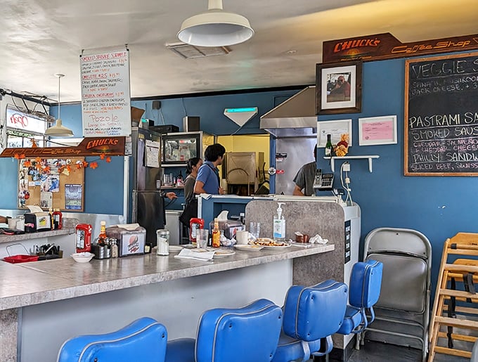 Classic blue vinyl stools at the counter offer front-row seats to the breakfast magic. It's diner theater at its finest.