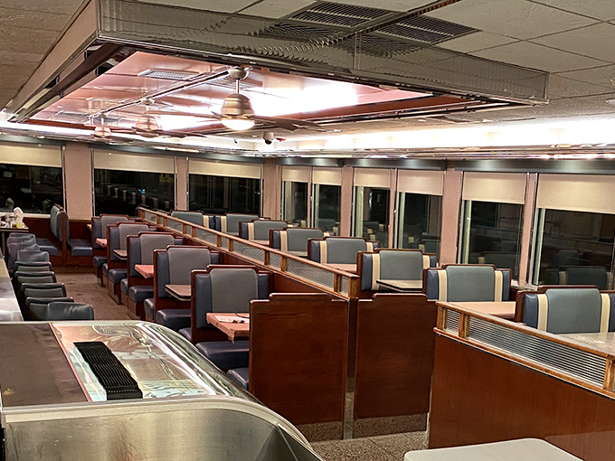 The quintessential diner booths await your sliding entrance, where countless life decisions have been made over coffee refills and syrup-soaked debates.