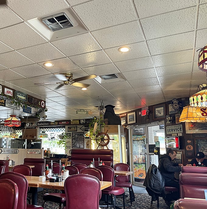 Step inside and time stands still – burgundy booths, nautical decor, and that unmistakable diner buzz that feels like a warm hug from your favorite aunt.