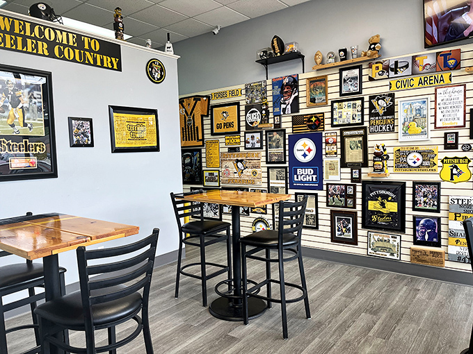 Steeler Nation has clearly planted its flag in Ohio territory. This wall of Pittsburgh sports memorabilia isn't decoration—it's a declaration of pizza allegiance.