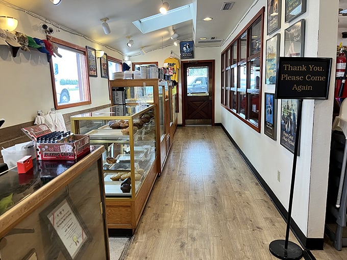 The pie display corridor—where breakfast dreams and dessert fantasies collide. That "Thank You, Please Come Again" sign is completely unnecessary after you've tasted their food.