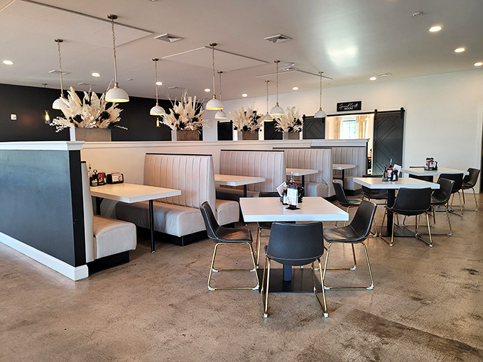 Modern meets cozy in this thoughtfully designed space. Those cream-colored booths practically whisper, "Stay awhile, friend."