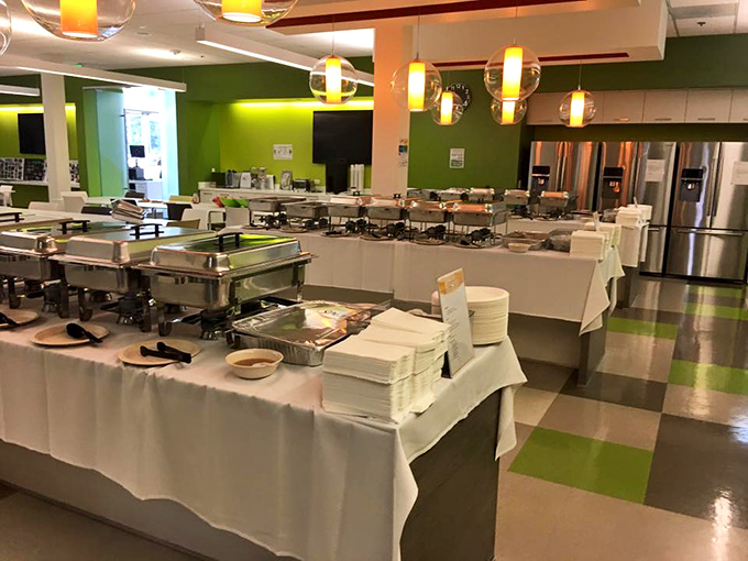 The buffet setup at UlavacharU is a masterclass in temptation – bright green walls and gleaming serving stations promising flavor adventures.