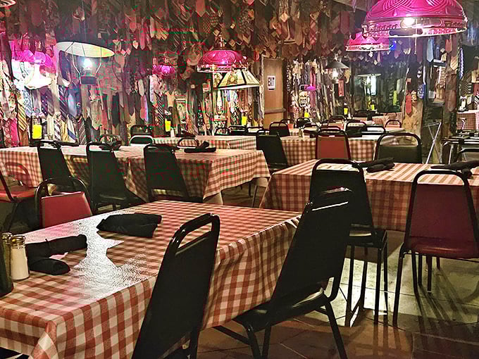Red checkered tablecloths and rustic charm create the perfect backdrop for serious steak conversations.