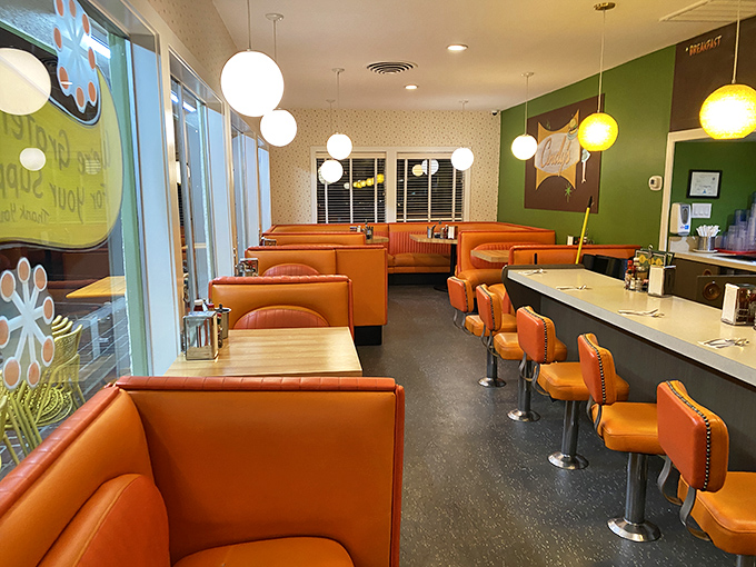 Orange vinyl booths and pendant lights create the perfect backdrop for breakfast epiphanies. This isn't retro by design—it's authentic by survival.