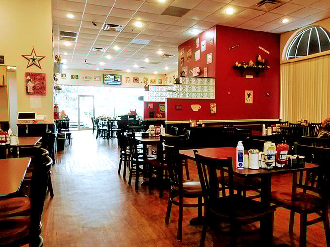 Inside, the warm wooden floors and cherry-red accent wall create that perfect diner atmosphere—not too fancy, not too casual, just right for serious breakfast business.
