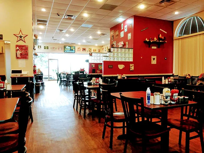 Inside, the warm wooden floors and cherry-red accent wall create that perfect diner atmosphere—not too fancy, not too casual, just right for serious breakfast business.