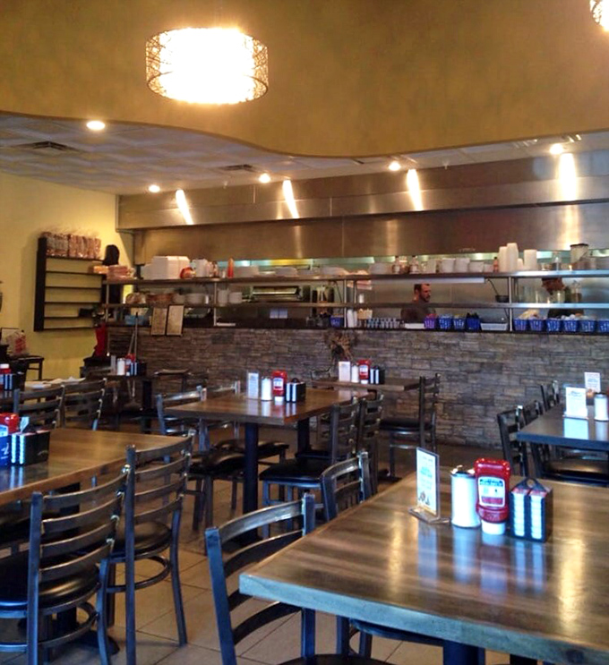 Inside, the warm stone accents and open kitchen create that perfect diner atmosphere—casual enough for breakfast, nice enough for a lunch meeting.