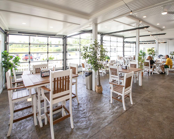Bright, airy, and inviting—the café's garage-door windows create an indoor-outdoor experience that says, "Stay awhile, the cheese isn't going anywhere."