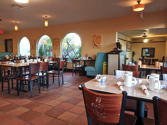 Terra cotta tiles and warm arched windows create the perfect backdrop for morning conversations. Sunlight streams in, making even coffee refills feel special.