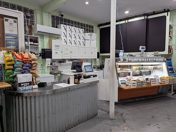 No-frills interior where culinary magic happens. Like your favorite uncle's workshop, but instead of birdhouses, they're crafting seafood perfection.