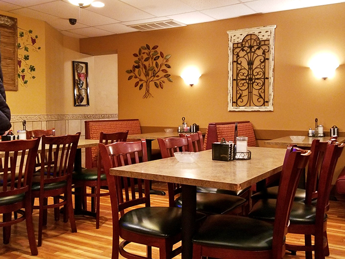 Warm golden walls, wooden chairs, and homey decor create that rare atmosphere money can't buy—the feeling you've stumbled into someone's well-loved dining room.
