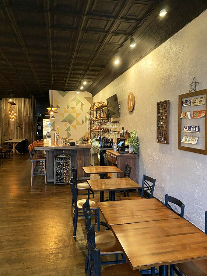 Step inside to discover rustic-meets-refined charm with wooden tables, a stunning tin ceiling, and geometric wall art. The dining room whispers "stay awhile" without saying a word.