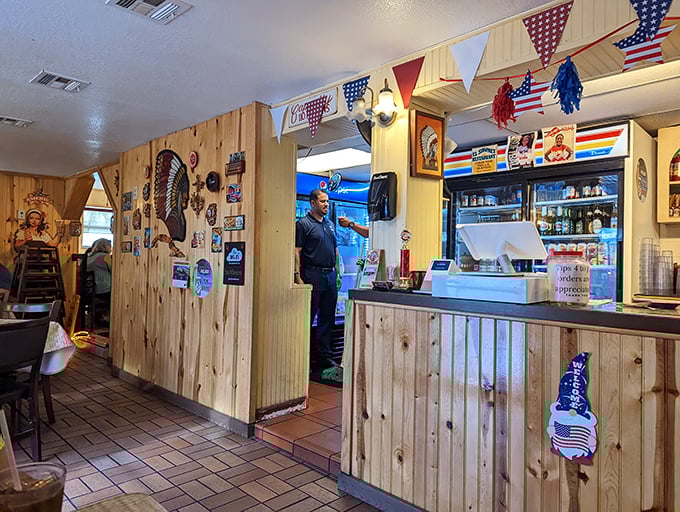 Knotty pine paneling and festive flags create that perfect "your Cuban grandmother's dining room" vibe that no designer could replicate.