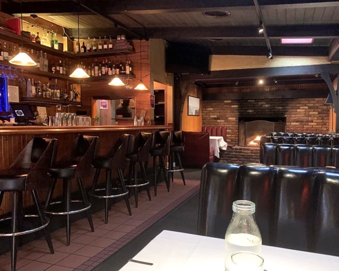 Where time stands still in the best possible way—brick fireplace, well-stocked bar, and leather booths that have cradled countless celebrations and confessions.