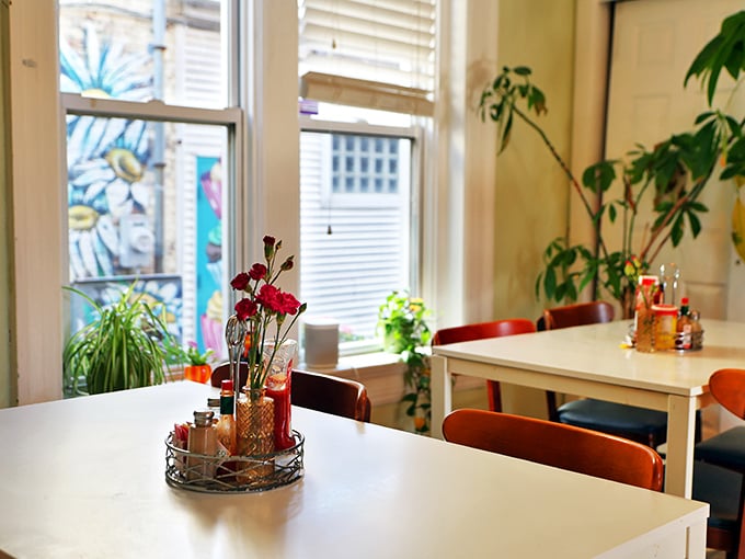 Indoor gardens and fresh flowers at every table—because nothing says "we care" like keeping both plants and customers well-fed.