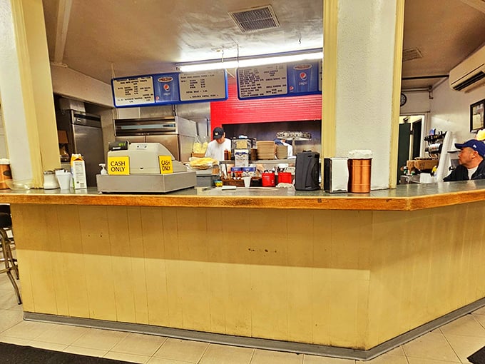 Behind this humble counter, culinary magic happens daily. No fancy digital displays or artisanal signage—just the promise of honest-to-goodness deliciousness.
