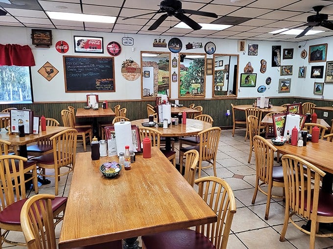 Classic Americana on full display – wooden tables, memorabilia-covered walls, and ceiling fans that have witnessed countless "mmms" of satisfaction.