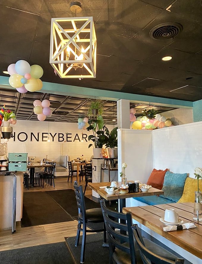 Step inside to a world where geometric light fixtures, pastel balloons, and comfy bench seating conspire to make you forget you woke up at 7 AM.