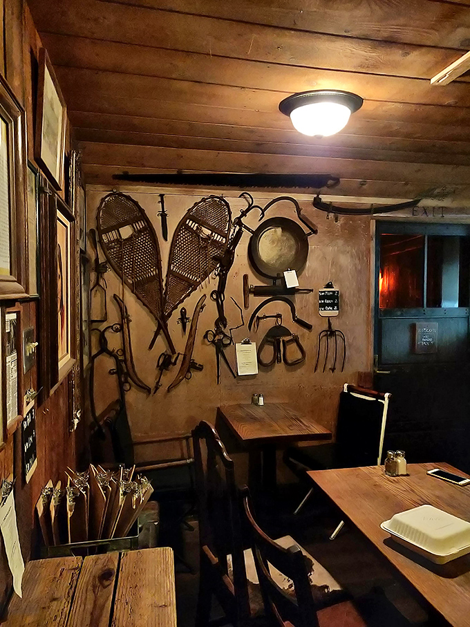 Vintage snowshoes and antique tools adorn the walls, creating an authentic frontier atmosphere. This isn't décor from a catalog—it's a carefully curated museum of California's pioneering past.