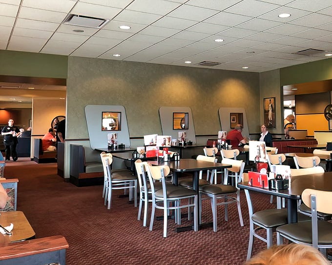 Inside, the perfect balance of cozy and spacious awaits—where booths become temporary homes and conversations flow as freely as the coffee.