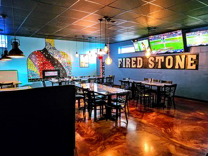 Inside, vibrant mosaic art pops against cool blue walls while the amber epoxy floors gleam like a sunset. This isn't just dining—it's destination therapy.