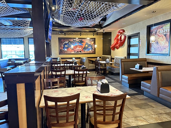 Fishing nets overhead and nautical decor set the stage for seafood theater. This isn't Instagram-bait design—it's the authentic backdrop for serious eating.