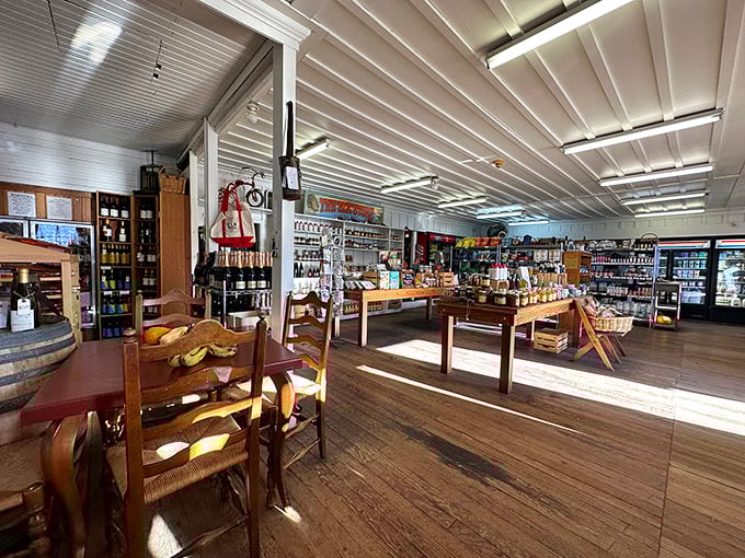 Sunlight dances across worn wooden floors while shelves brim with essentials and delights—the perfect marriage of practicality and unexpected pleasure.