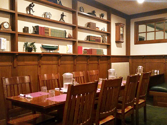 Wooden paneling and craftsman-style furniture create a library-meets-dining room atmosphere that says, "Stay awhile, there's plenty more where that came from."