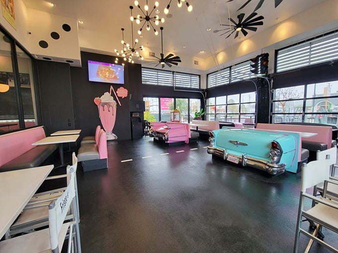 Car-shaped booths aren't just Instagram bait—they're the perfect vessels for your journey to flavor town. Pink Cadillacs and turquoise beauties make every meal feel like a sock hop.
