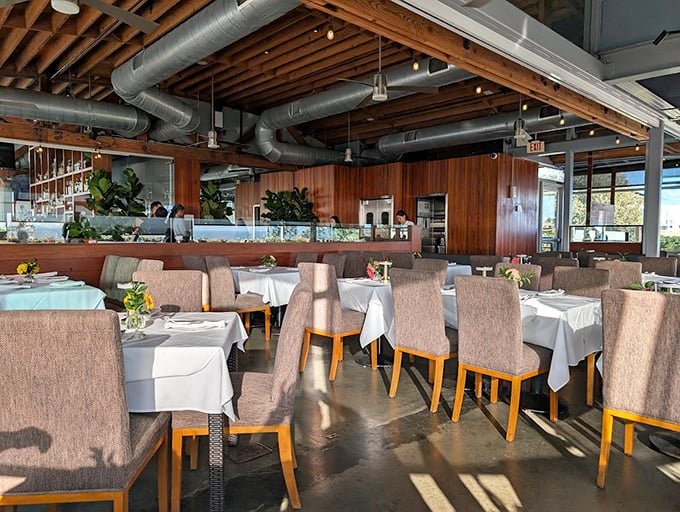 Wooden beams, exposed ductwork, and those crisp white tablecloths—this isn't just a restaurant, it's California coastal sophistication without the stuffiness.