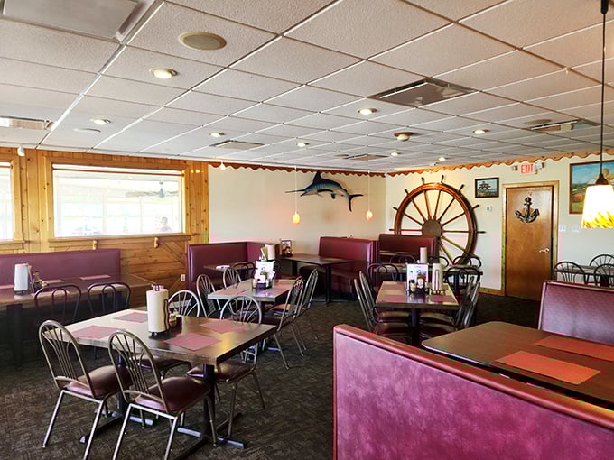 Nautical without being kitschy, this dining room says, "We're too busy perfecting our seafood to worry about interior design magazines." That ship's wheel isn't ironic—it's authentic.