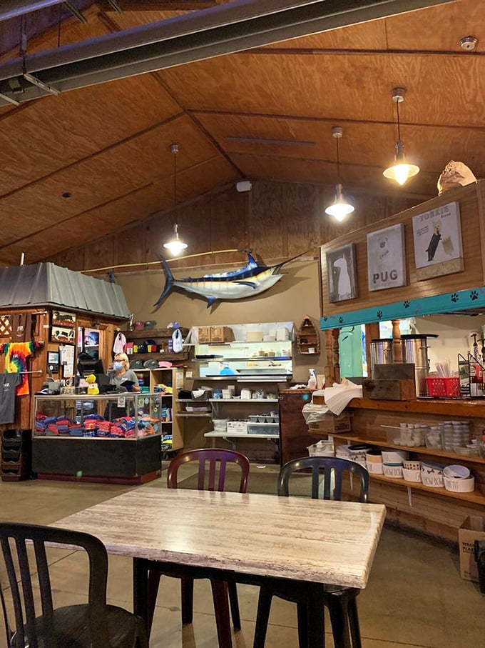 Inside, maritime meets mealtime with wooden walls that could tell stories of countless seafood feasts. That marlin didn't mount itself—someone's fishing tale came true.
