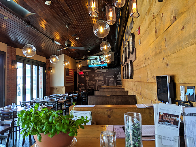 Wooden ceilings, globe lighting, and that perfect blend of rustic-meets-refined—this is where business deals and comfort food dreams happen simultaneously.