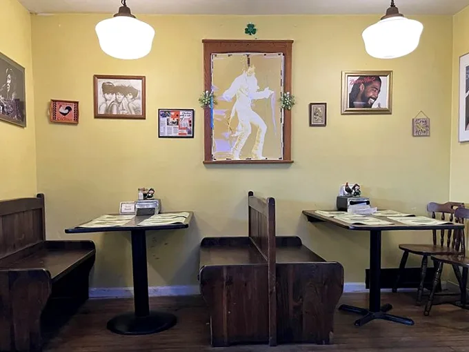 Church pew booths and an Elvis silhouette mirror create a quirky, soulful atmosphere where music legends watch over your meal like guardian angels of flavor.