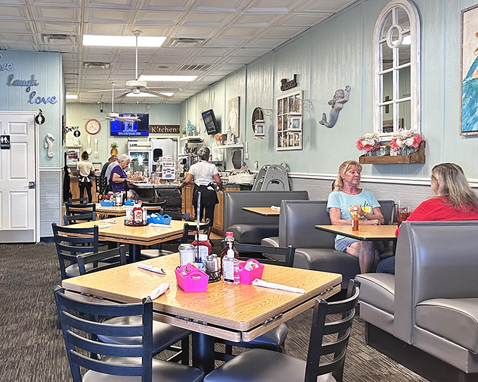 Blue walls and cozy booths create the perfect backdrop for breakfast magic. This isn't just a restaurant—it's Florida's living room.