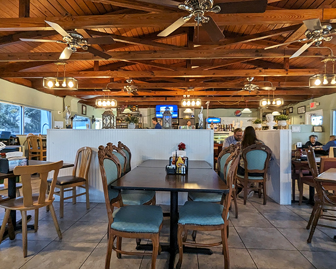 Wooden ceiling beams and comfortable teal chairs create that perfect diner atmosphere where conversations flow as freely as the coffee.