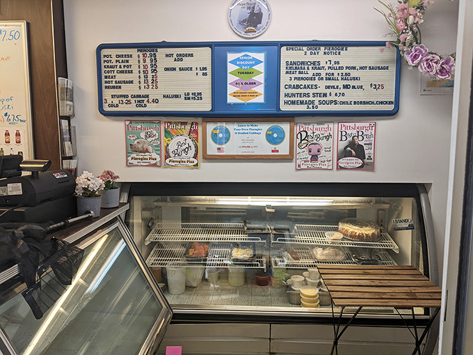 The menu board tells no lies—simple offerings with big flavors await behind that glass case, where Polish culinary traditions are preserved one dumpling at a time.