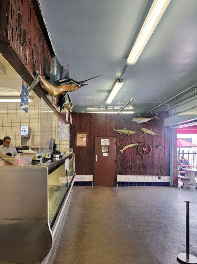 Mounted fish watch over diners like aquatic guardians of quality. The wood-paneled walls and nautical decor aren't trying to impress—they're too busy supporting an authentic seafood experience.