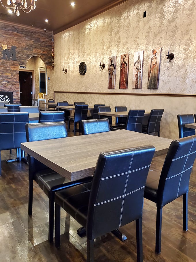 Elegant meets cozy in this thoughtfully designed dining room. The textured walls, artwork, and comfortable seating create an atmosphere that transports you far from Florida.