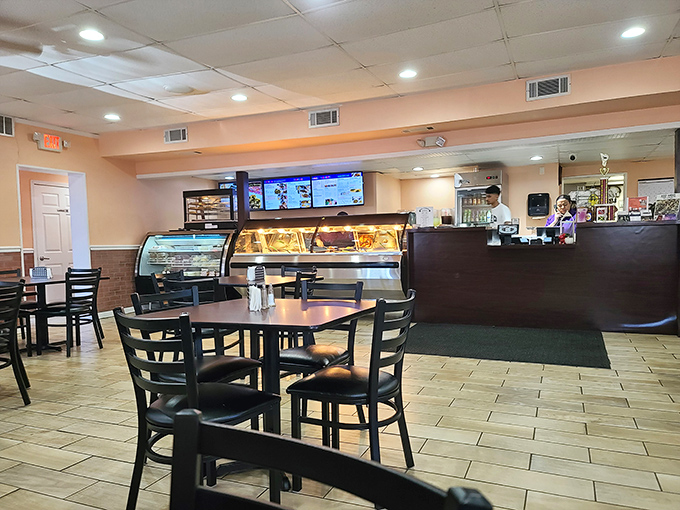 No-frills dining at its finest. The simple interior lets you focus on what matters – the symphony of Caribbean flavors waiting behind that counter.