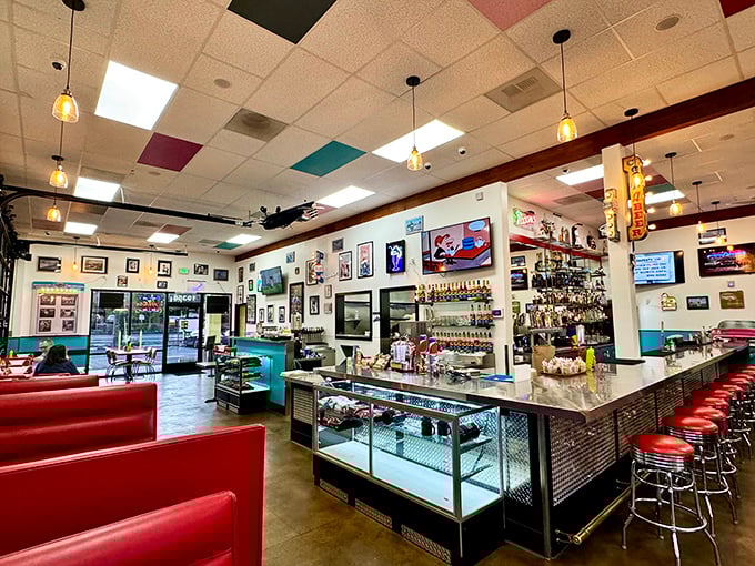 Step inside and the decades melt away—colorful ceiling tiles, red vinyl booths, and memorabilia create a time capsule where conversation flows as freely as the coffee.