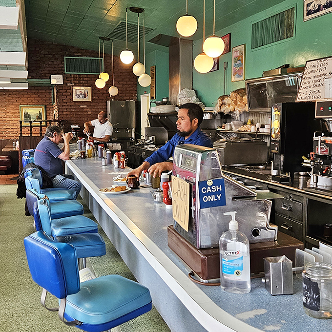 The counter seats aren't just the best show in town—they're front-row tickets to breakfast ballet performed by short-order maestros.