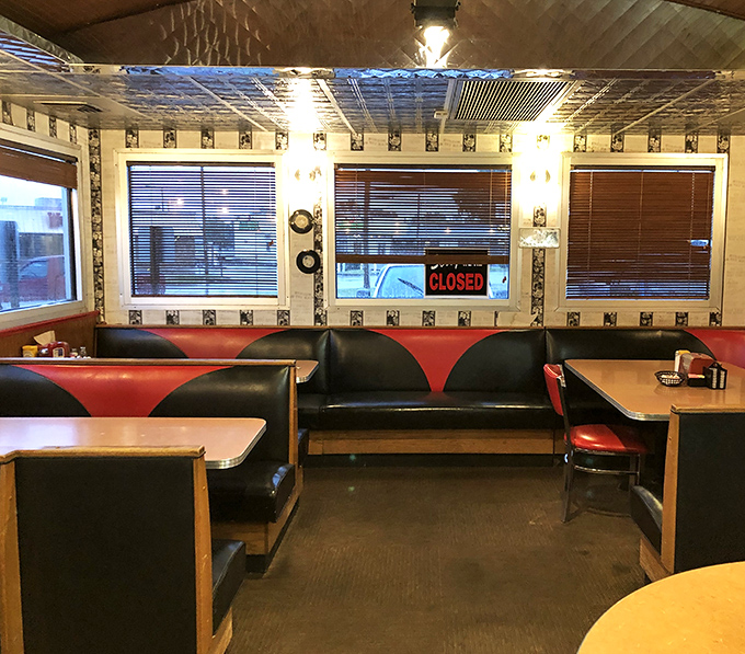 Red and black vinyl booths invite you to slide in and stay awhile. The metallic ceiling tiles reflect decades of good conversations and better meals.