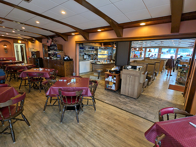 Step inside to burgundy tablecloths and wooden beams that whisper, "Stay awhile." This isn't Instagram-bait décor—it's the real deal of American diner comfort.