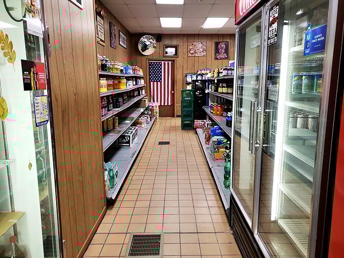 The classic corner store interior – wood paneling, American flag, and narrow aisles filled with snacks. This isn't Instagram-bait; it's the real deal.