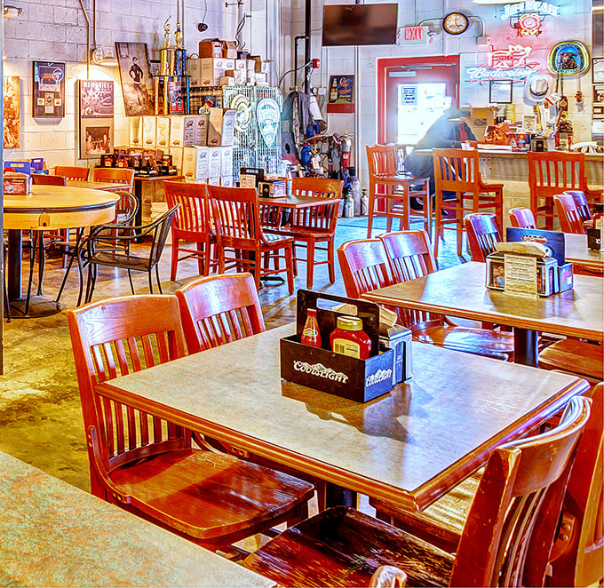 Wooden chairs, concrete floors, and walls adorned with barbecue memorabilia—this isn't interior design, it's a temple of smoke built for serious meat worship.