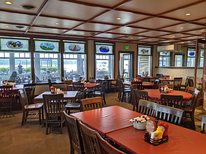 Wooden tables, stained glass windows, and water views create the perfect backdrop for memorable meals. No designer needed—just honest charm and spectacular scenery.
