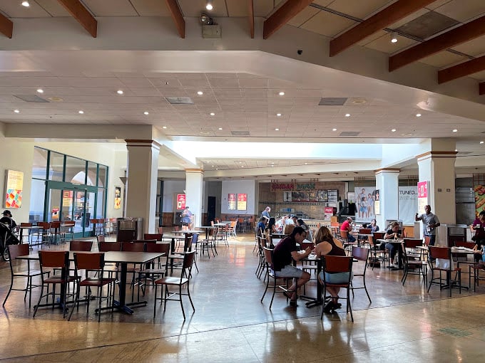 The food court: where shopping marathoners refuel before their next sprint through the sales racks. Strategic carb-loading at its finest.