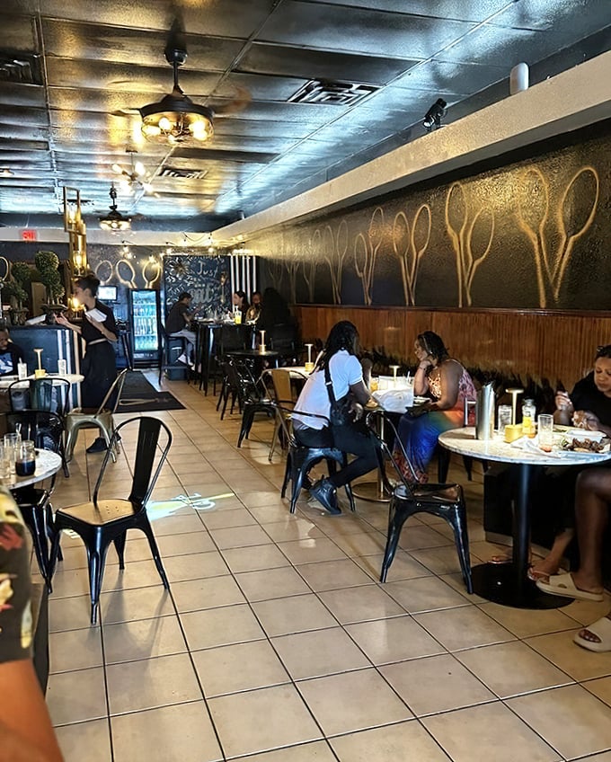 The spoon-adorned wall isn't just clever décor—it's a visual manifesto announcing that this place takes its comfort food seriously.